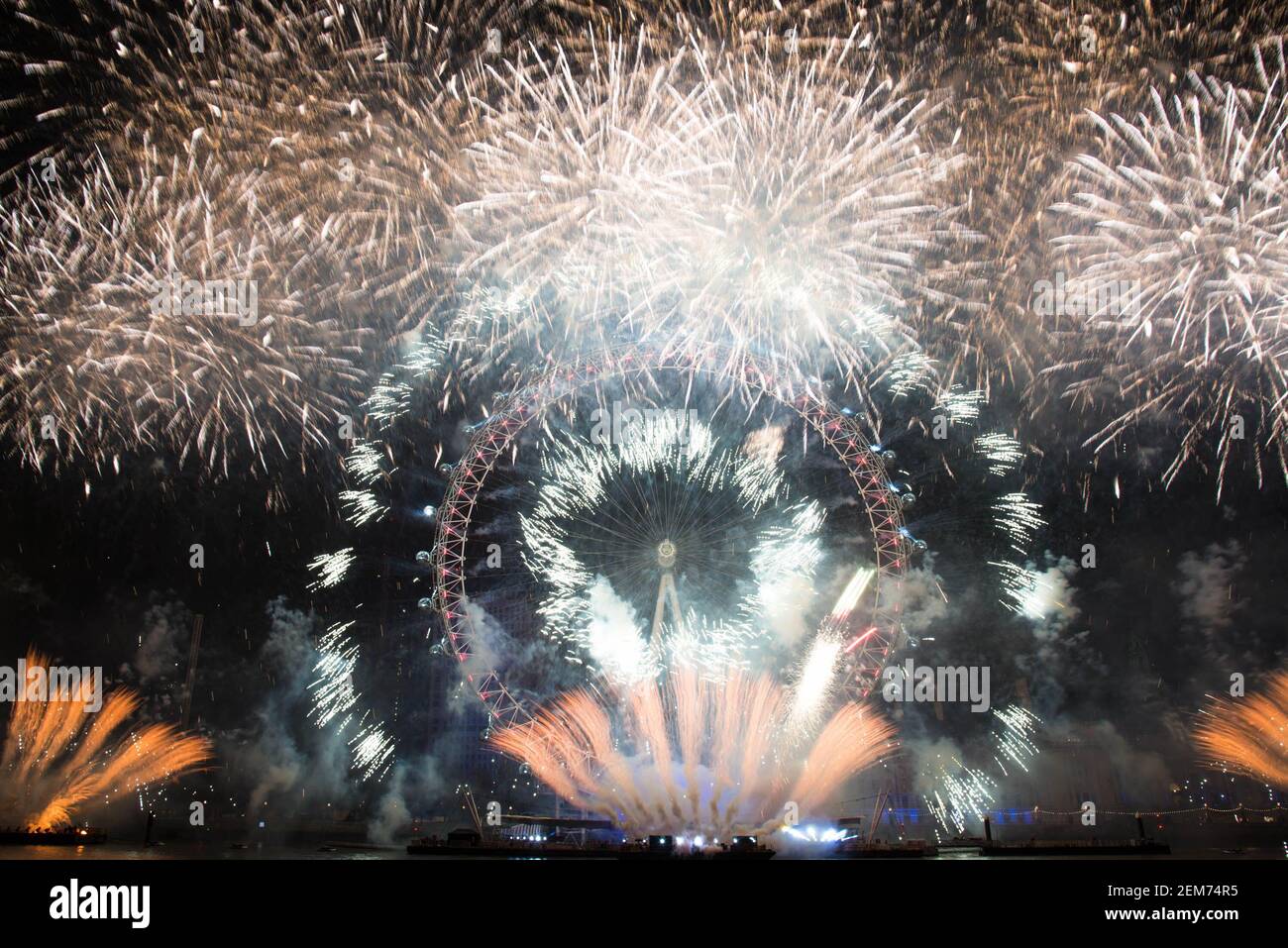 Fireworks light up the night sky over the Coca Cola London Eye in ...