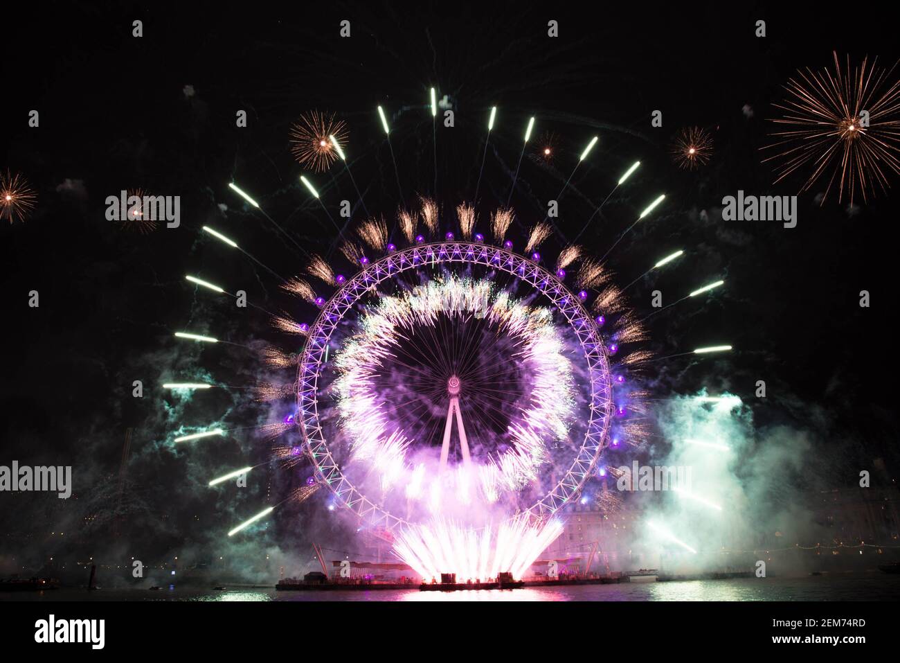Fireworks light up the night sky over the Coca Cola London Eye in ...