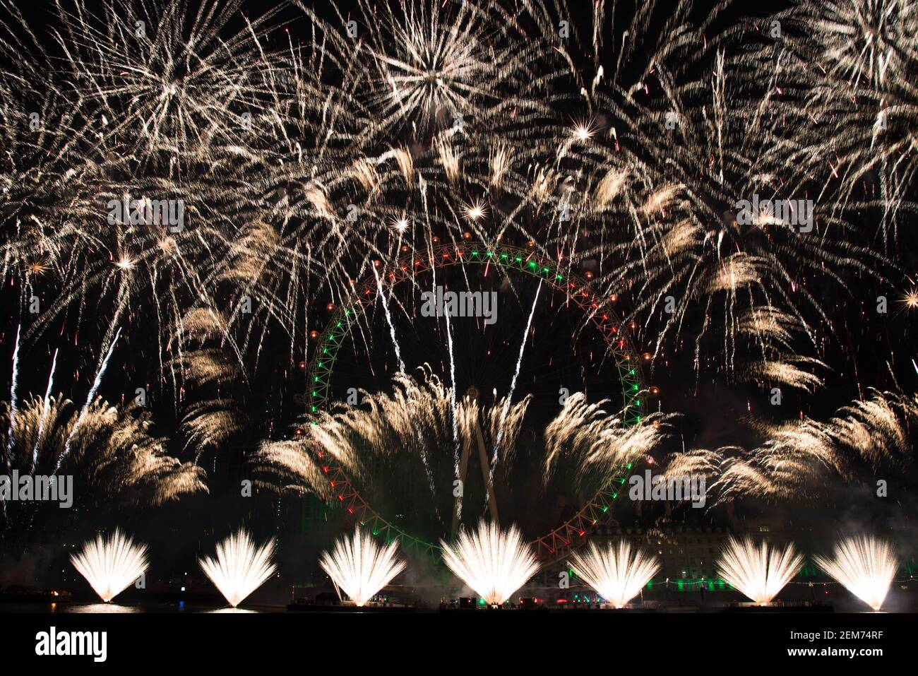 Fireworks light up the night sky over the Coca Cola London Eye in ...