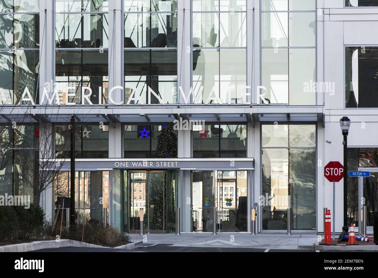 A logo sign outside of the headquarters of American Water in Camden ...