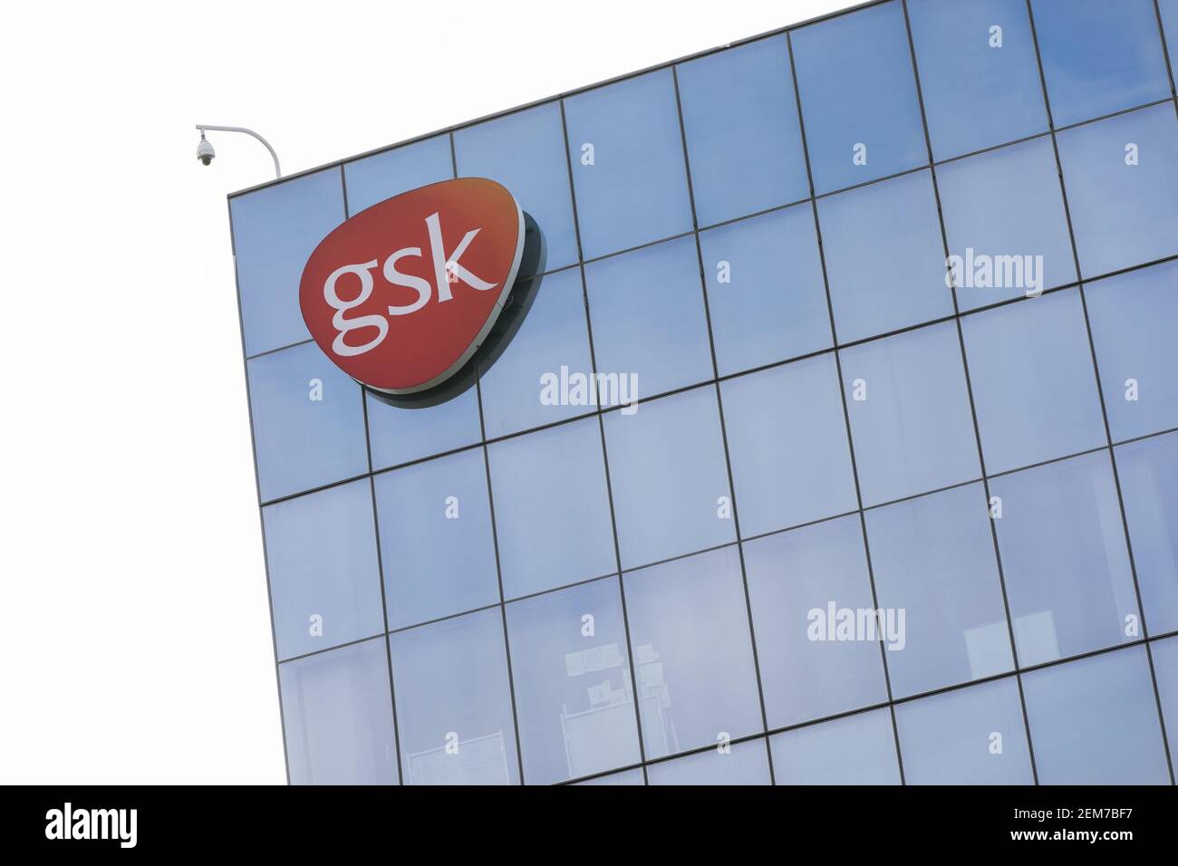 A logo sign outside of a facility occupied by GlaxoSmithKline (GSK) in ...