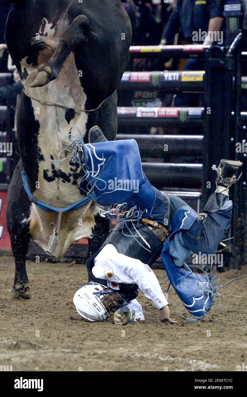 Professional bull rider Ezekiel Mitchell from Texas lands head down ...