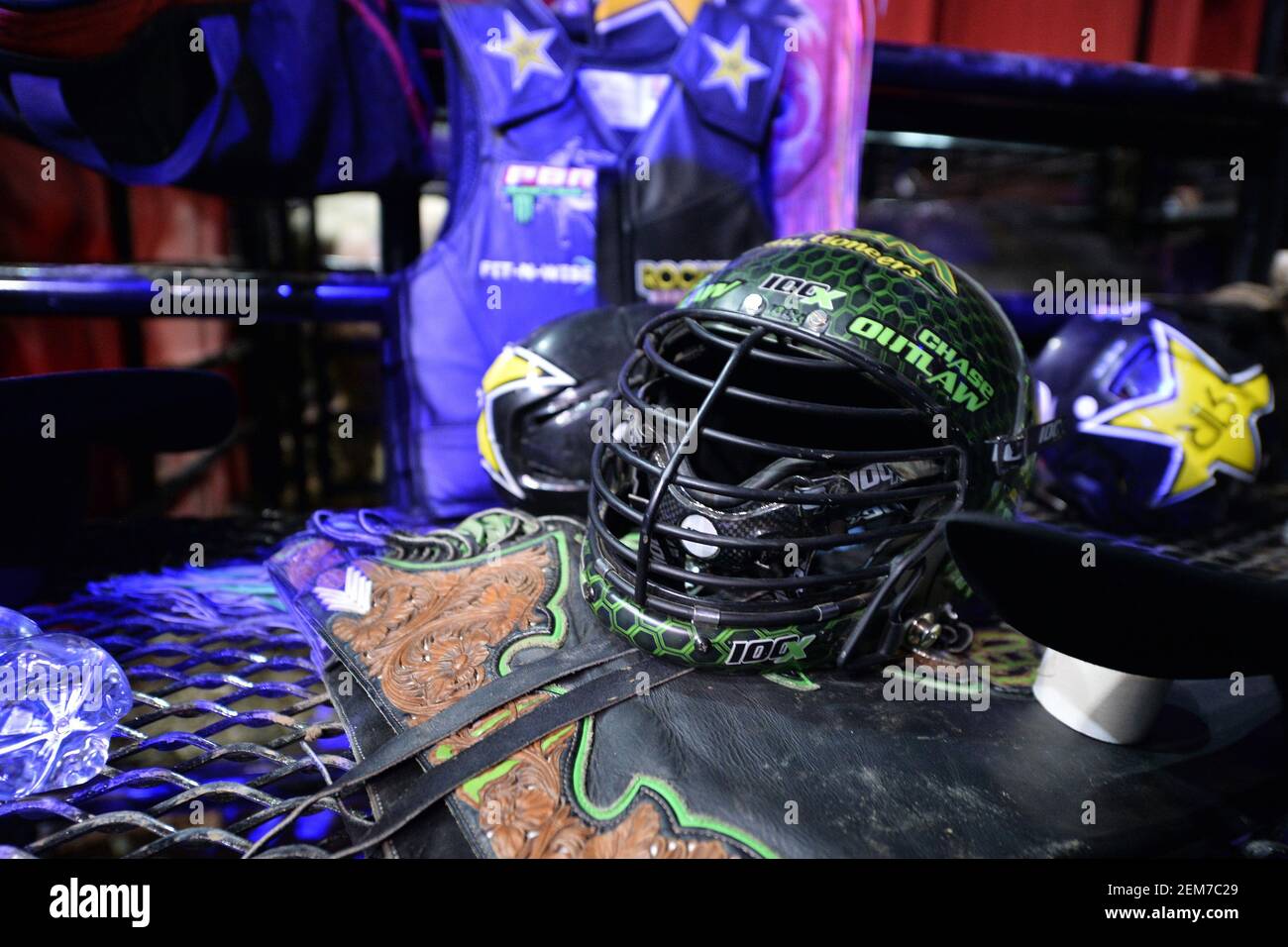 Professional bull riding gear, including helmet and chaps, is laid out ...