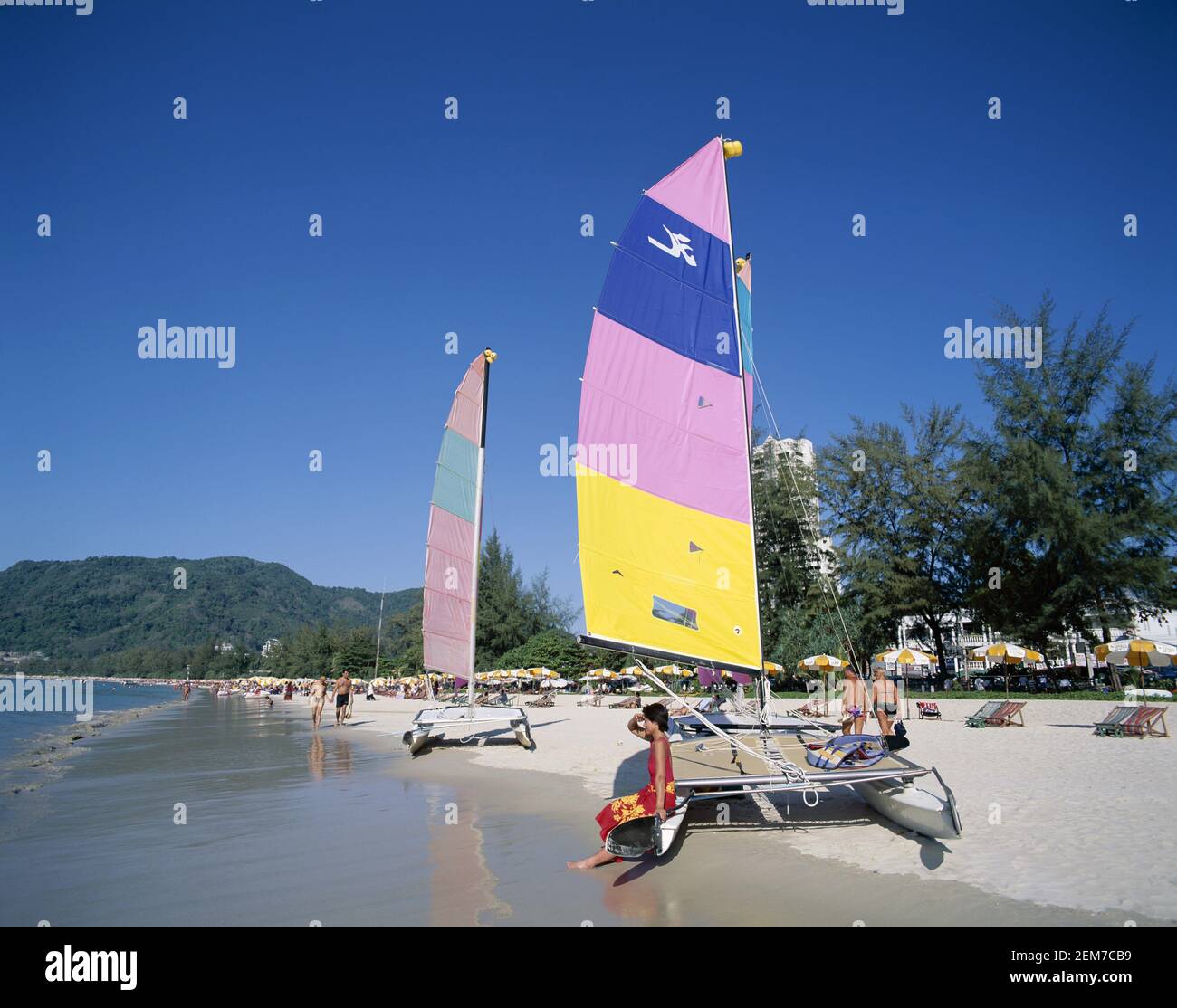 Asia,Thailand, Phuket Island, colourful outrigger canoes and tourists ...