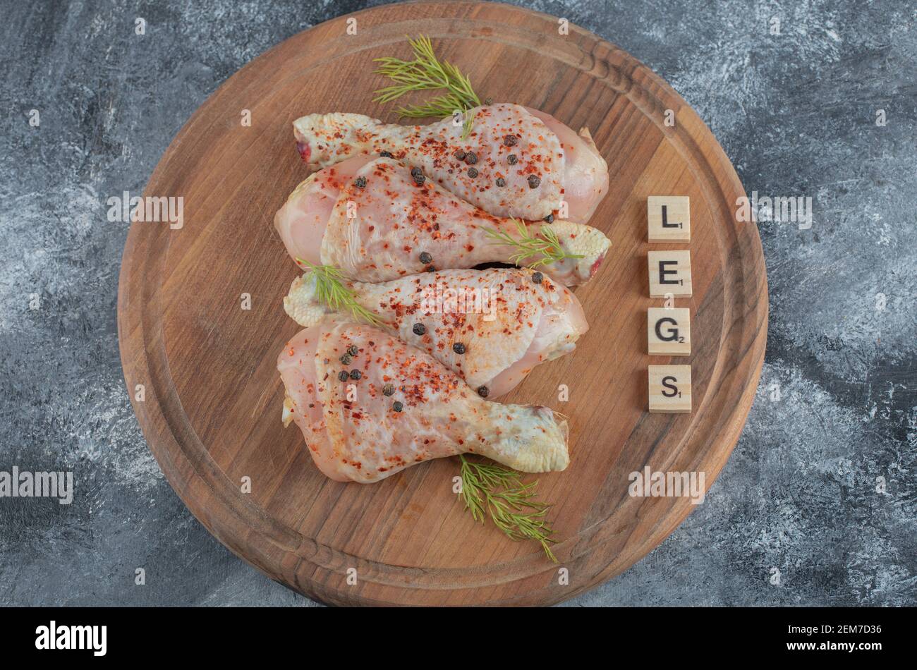Cube letters writing LEGS with raw chicken legs Stock Photo - Alamy