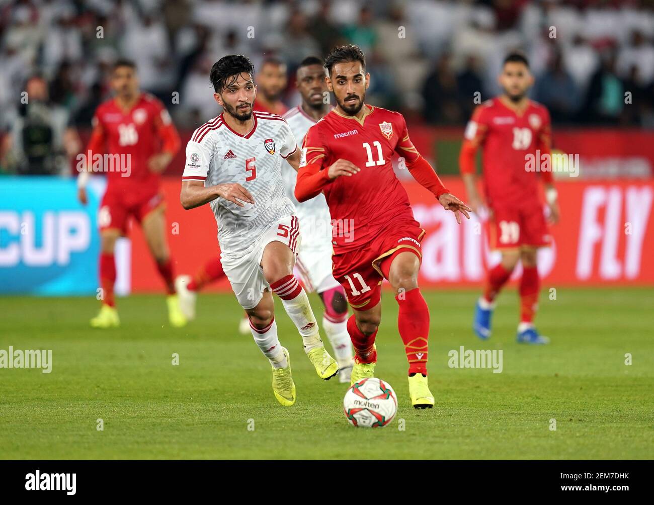 Ali Madan of Bahrain going past Amer Abdulrahman of United Arab ...