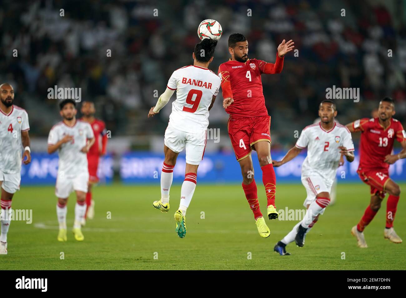 Bandar Al-Ahbabi of United Arab Emirates heading the ball in front of ...