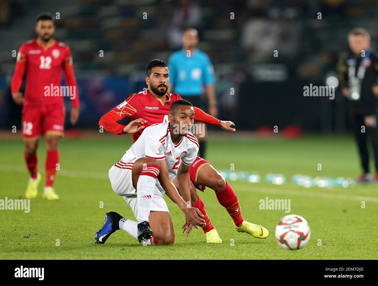Sayed Dhiya Saeed of Bahrain passing the ball in front of Ali Salmeen ...