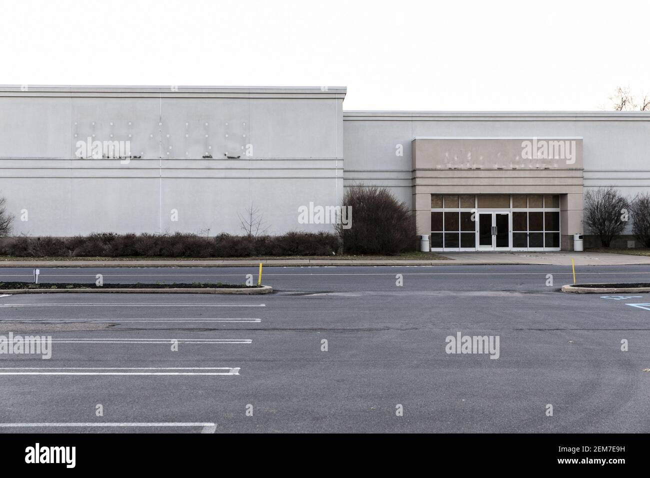The outline of a logo sign at a closed Sears retail store in ...