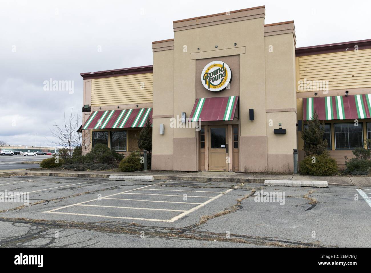A logo sign outside of an abandoned Ground Round restaurant in Hazleton ...
