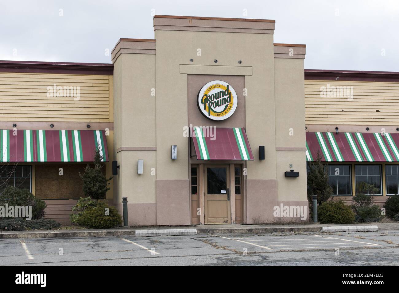 A logo sign outside of an abandoned Ground Round restaurant in Hazleton ...