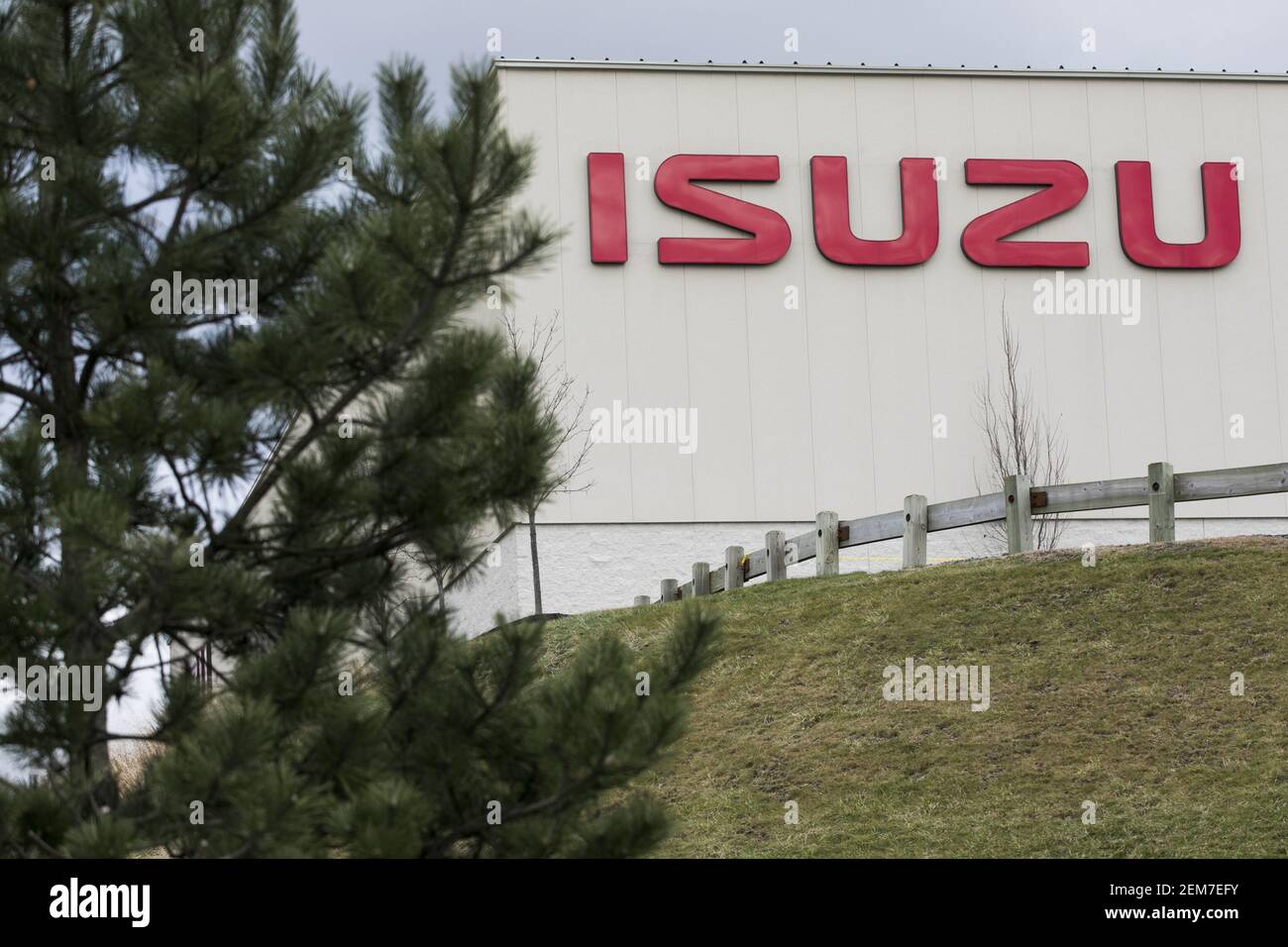 A logo sign outside of a facility occupied by Isuzu Motors Ltd., in ...