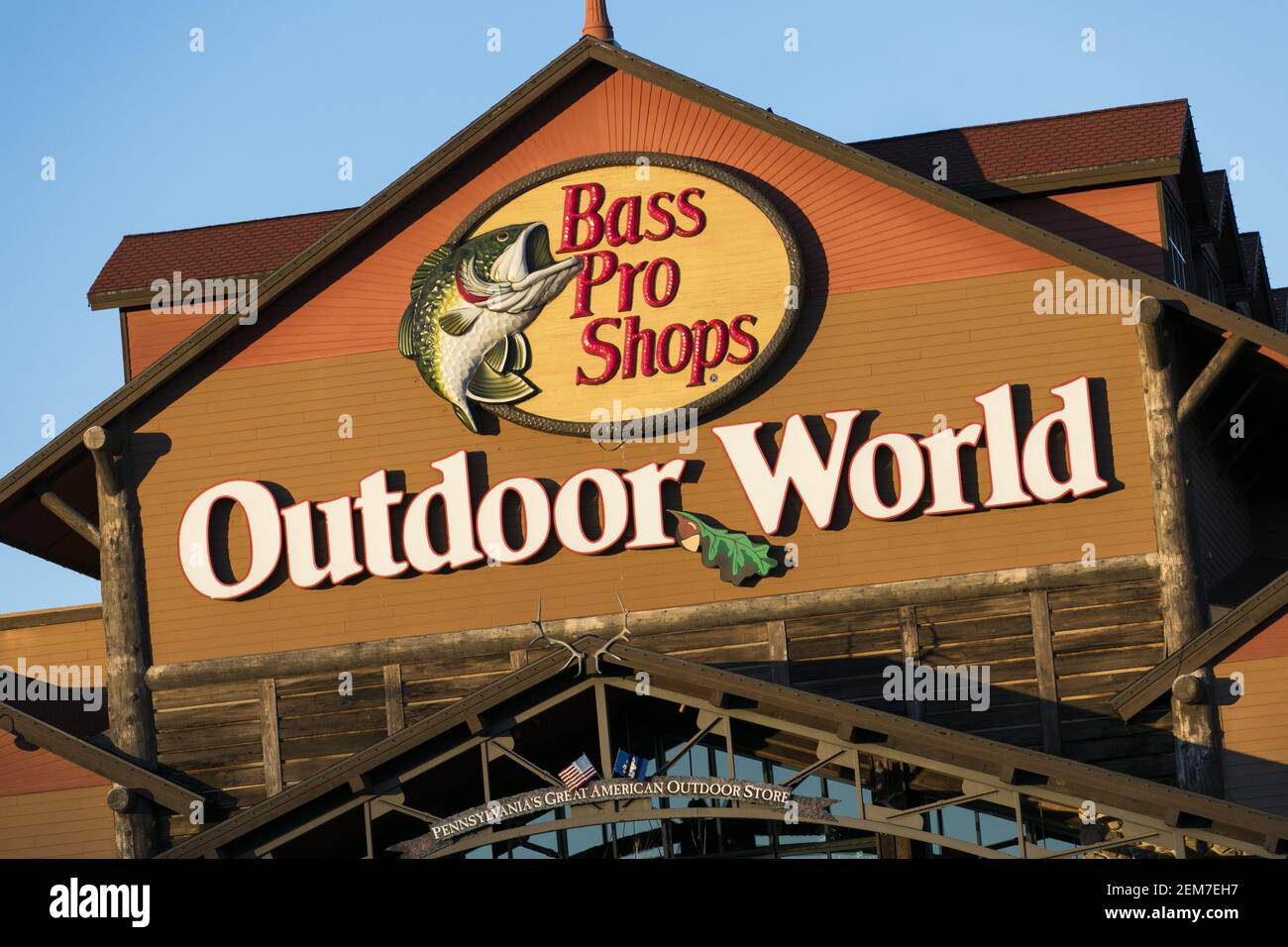 A logo sign outside of a Bass Pro Shops Outdoor World retail store in ...