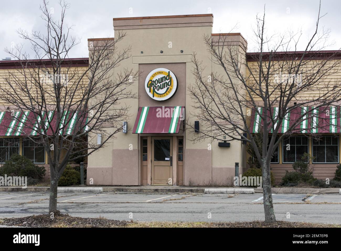 A logo sign outside of an abandoned Ground Round restaurant in Hazleton ...