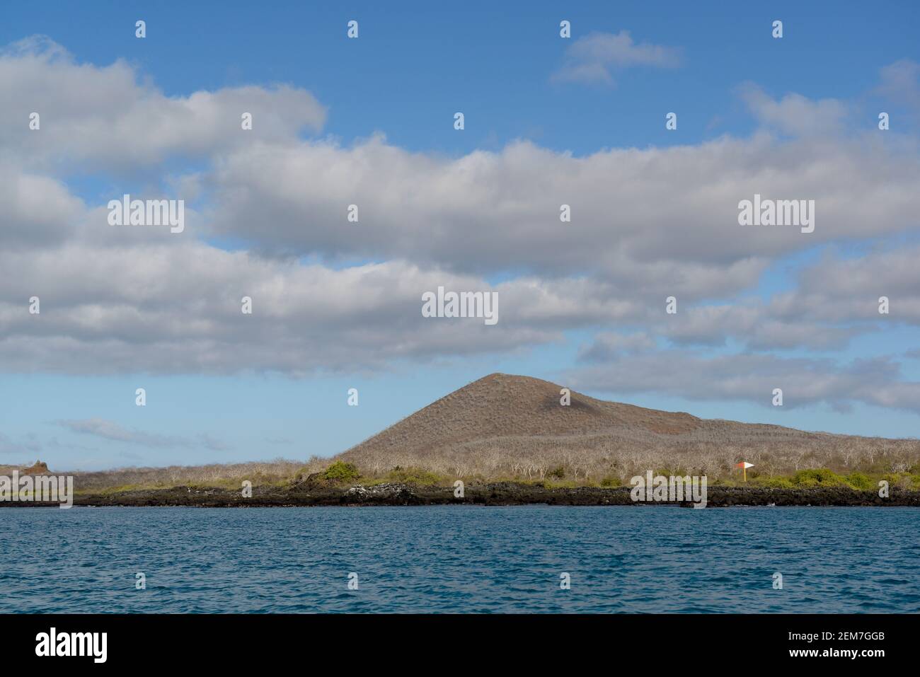 Coastline of Floreana Island with a tourist area marker, Galapagos ...