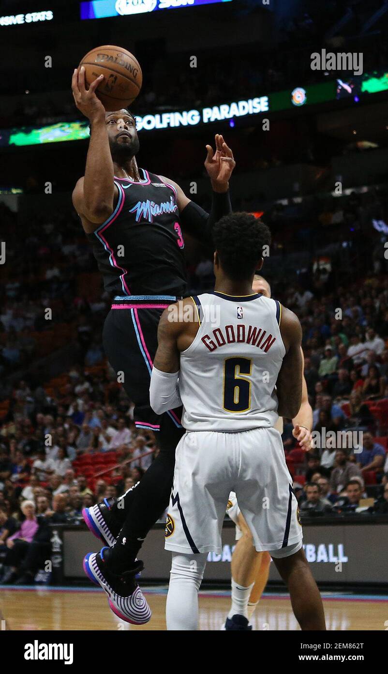 The Miami Heat's Dwyane Wade (3) goes to the basket against the Denver ...