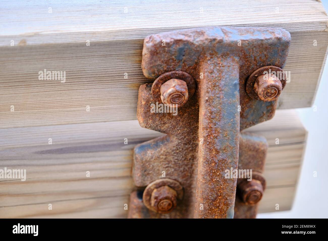 Wooden bench, metal side exposed to corrosion and remainings of ...