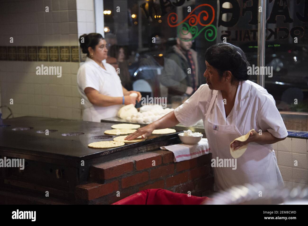 Women make hand made tortillas at the Old Town Mexican Cafe, Old Town ...
