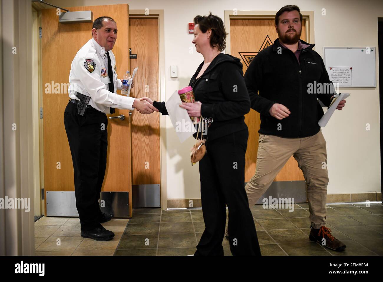 Shelly Heup, who says she's from the Barron County area, shakes hands ...