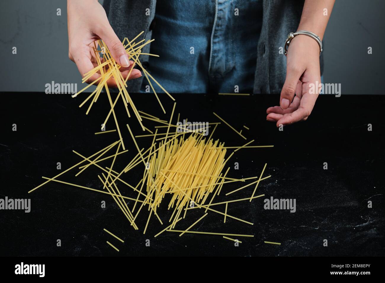 Woman holding pasta table hi-res stock photography and images - Alamy