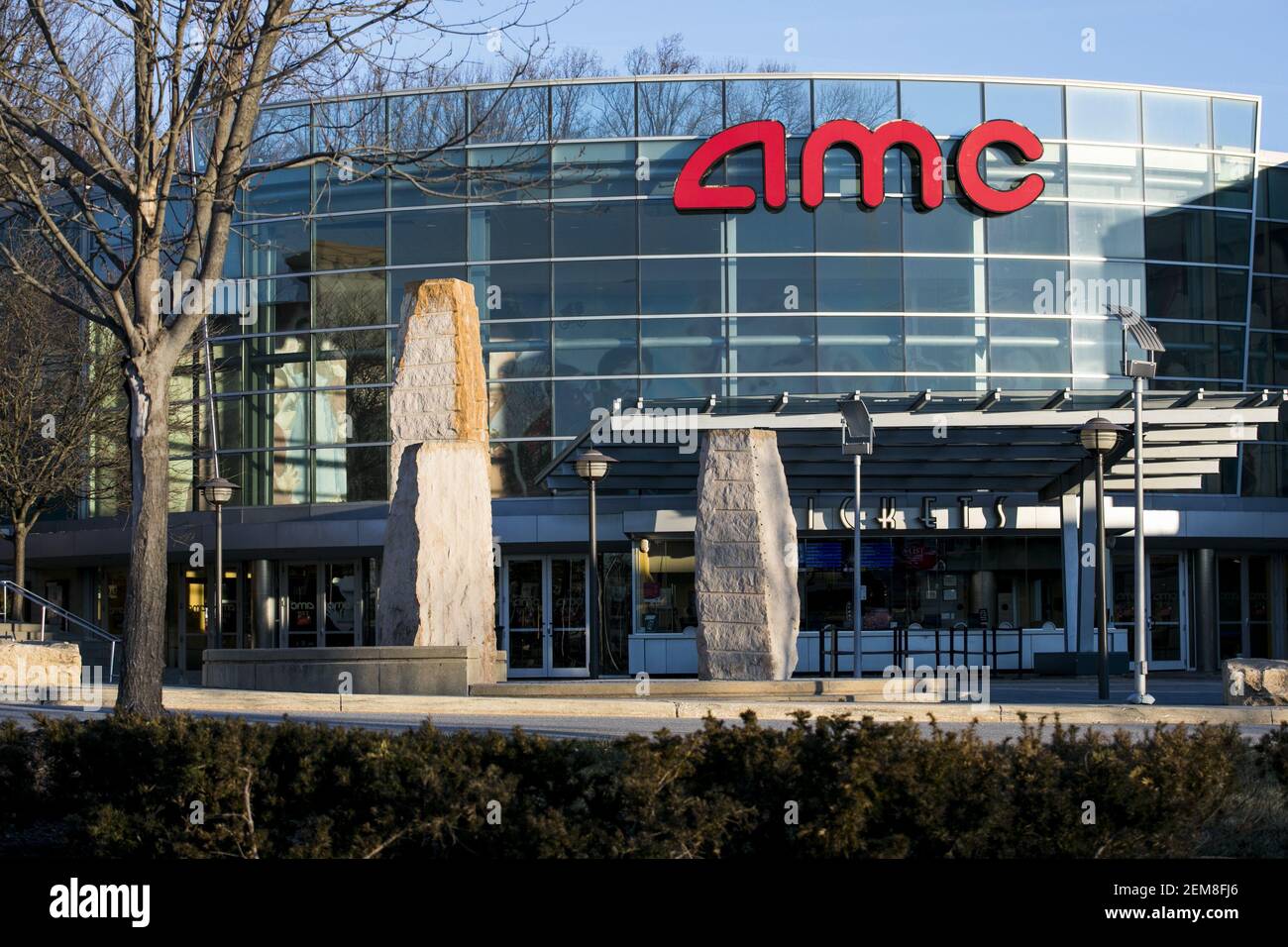 A logo sign outside of a AMC Theatres movie theater in Columbia ...