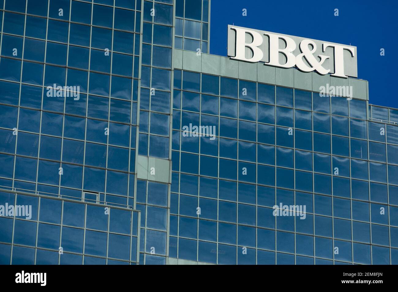 A logo sign outside of a facility occupied by BB&T Bank in Baltimore ...