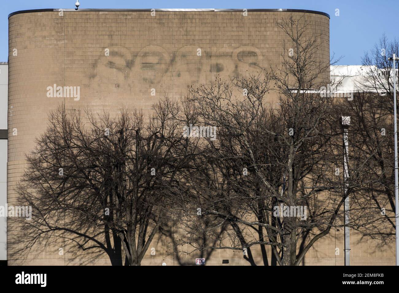 The outline of a Sears logo sign outside of a closed retail store ...