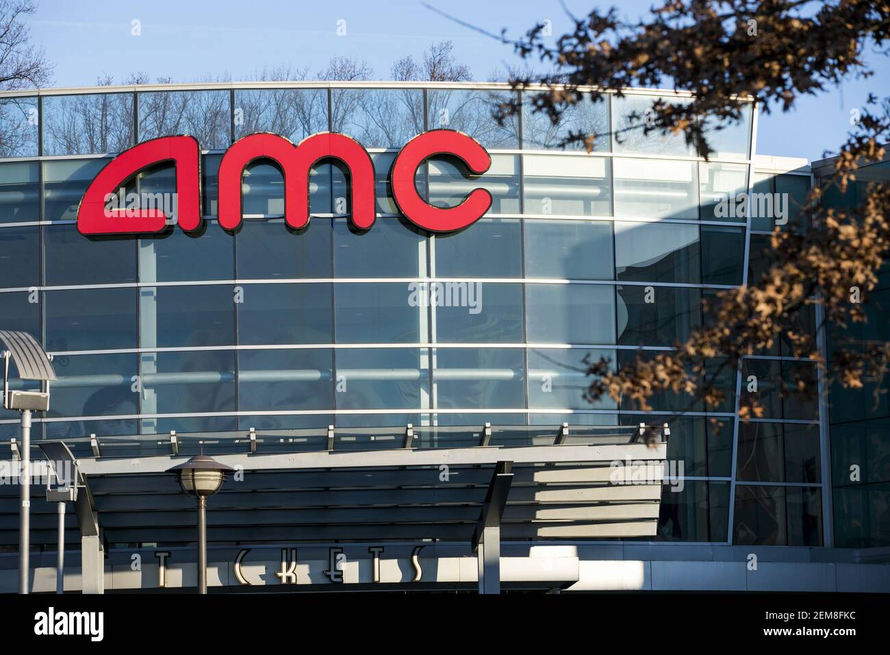 A logo sign outside of a AMC Theatres movie theater in Columbia ...