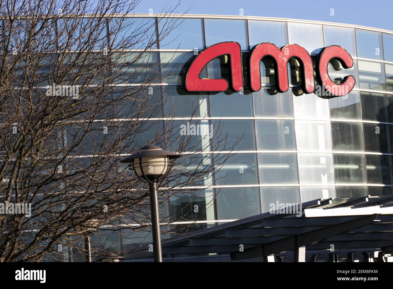 A logo sign outside of a AMC Theatres movie theater in Columbia ...