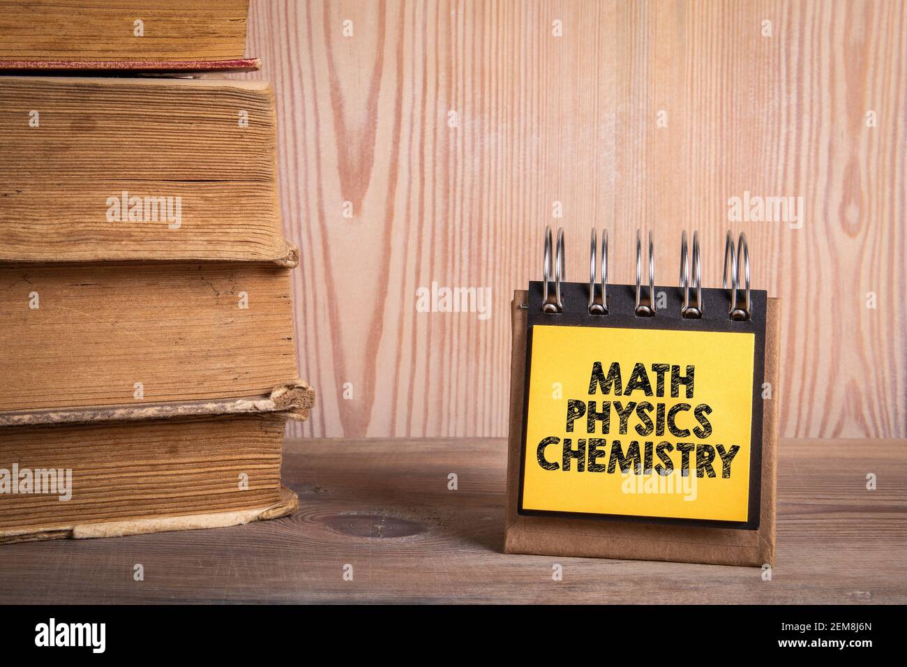 Math Physics Chemistry. Stack of books and a notebook on a shelf Stock ...