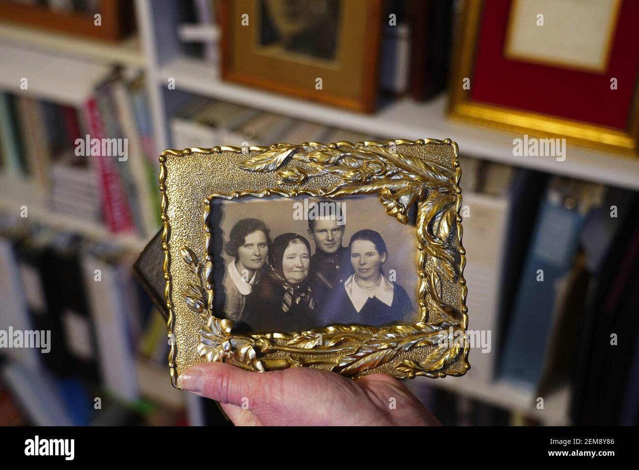Silvia Foti holds a photograph of her family on Jan. 11, 2019. In the ...