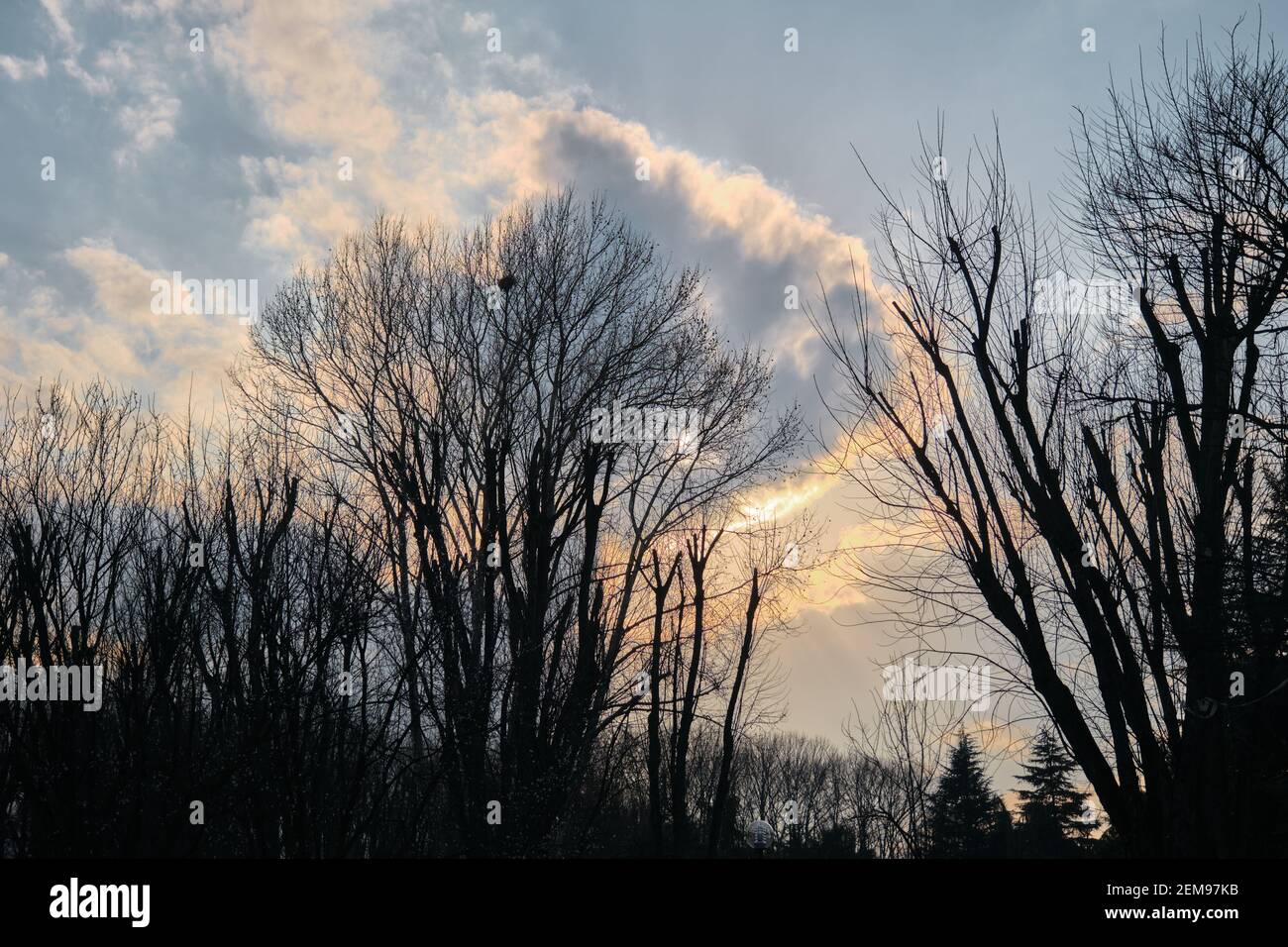 Sunset sky, huge clouds and sunshine reflection on the cloud together ...