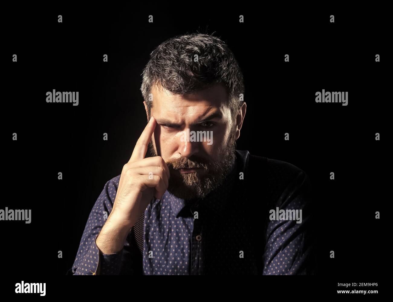 Man thinking in formal outfit isolated on black background. Business ...