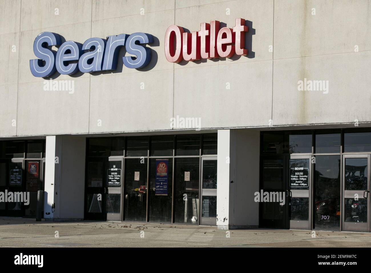 A logo sign outside of a Sears Outlet retail store location in ...