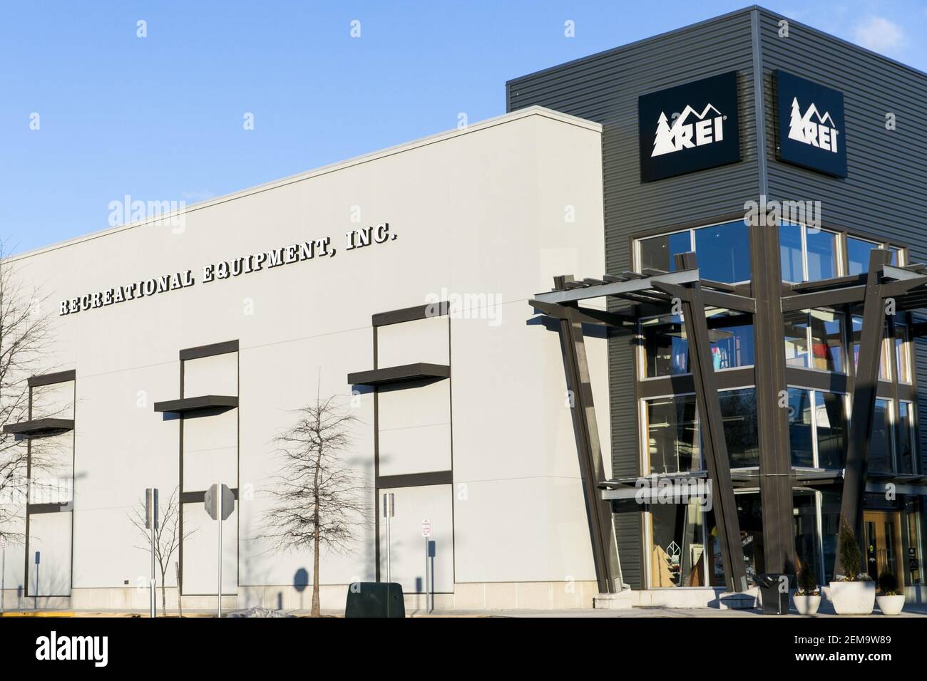 A logo sign outside of a REI (Recreational Equipment, Inc.) retail ...