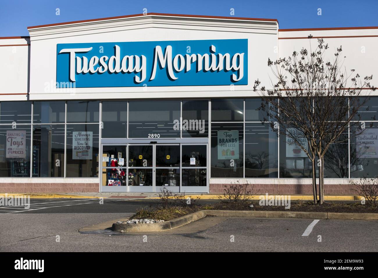A logo sign outside of a Tuesday Morning retail store location in ...