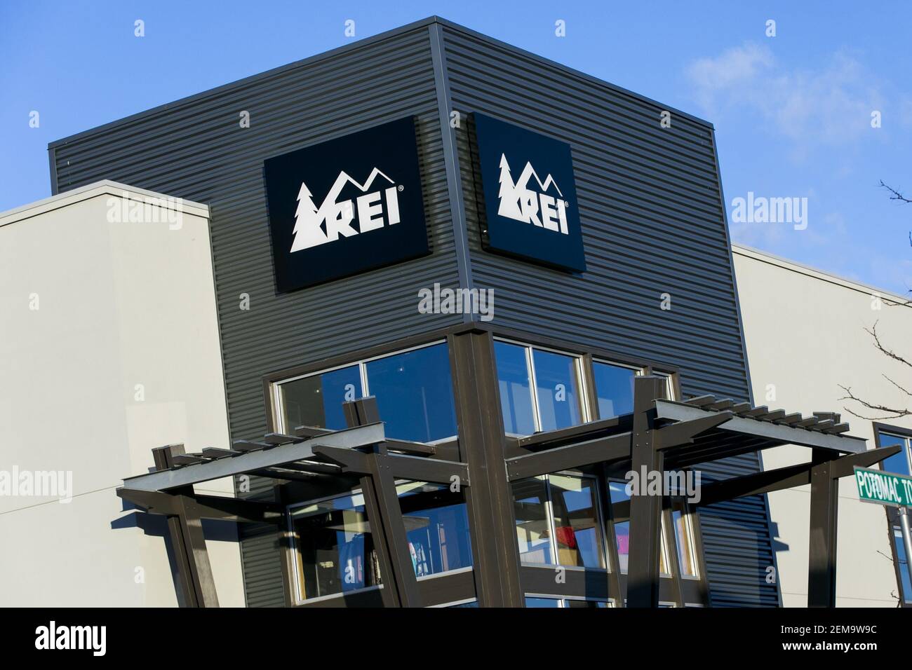 A logo sign outside of a REI (Recreational Equipment, Inc.) retail ...