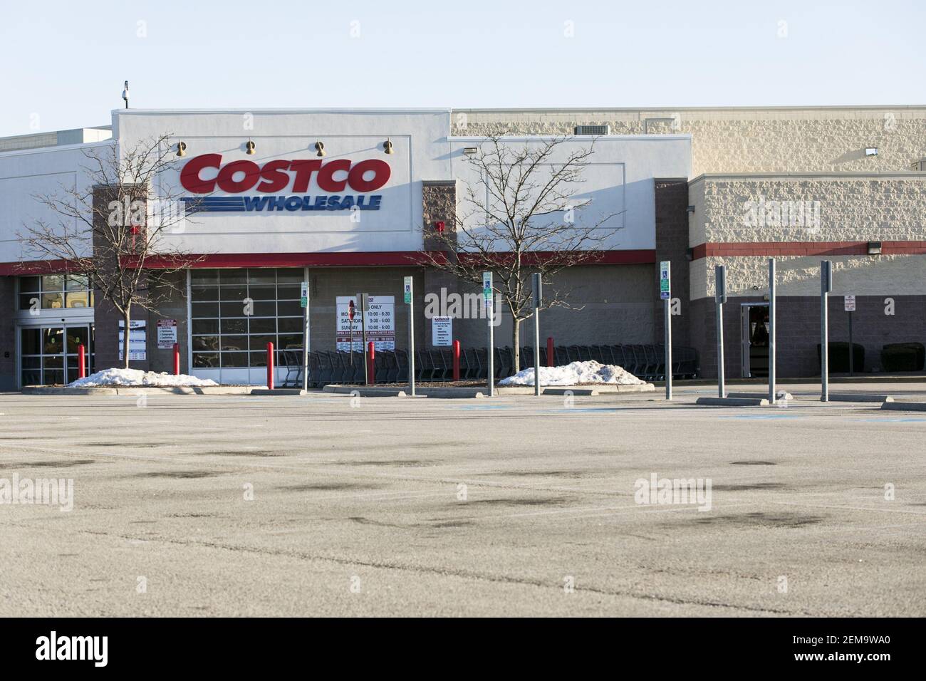 A logo sign outside of a Costco Wholesale warehouse store in Woodbridge ...
