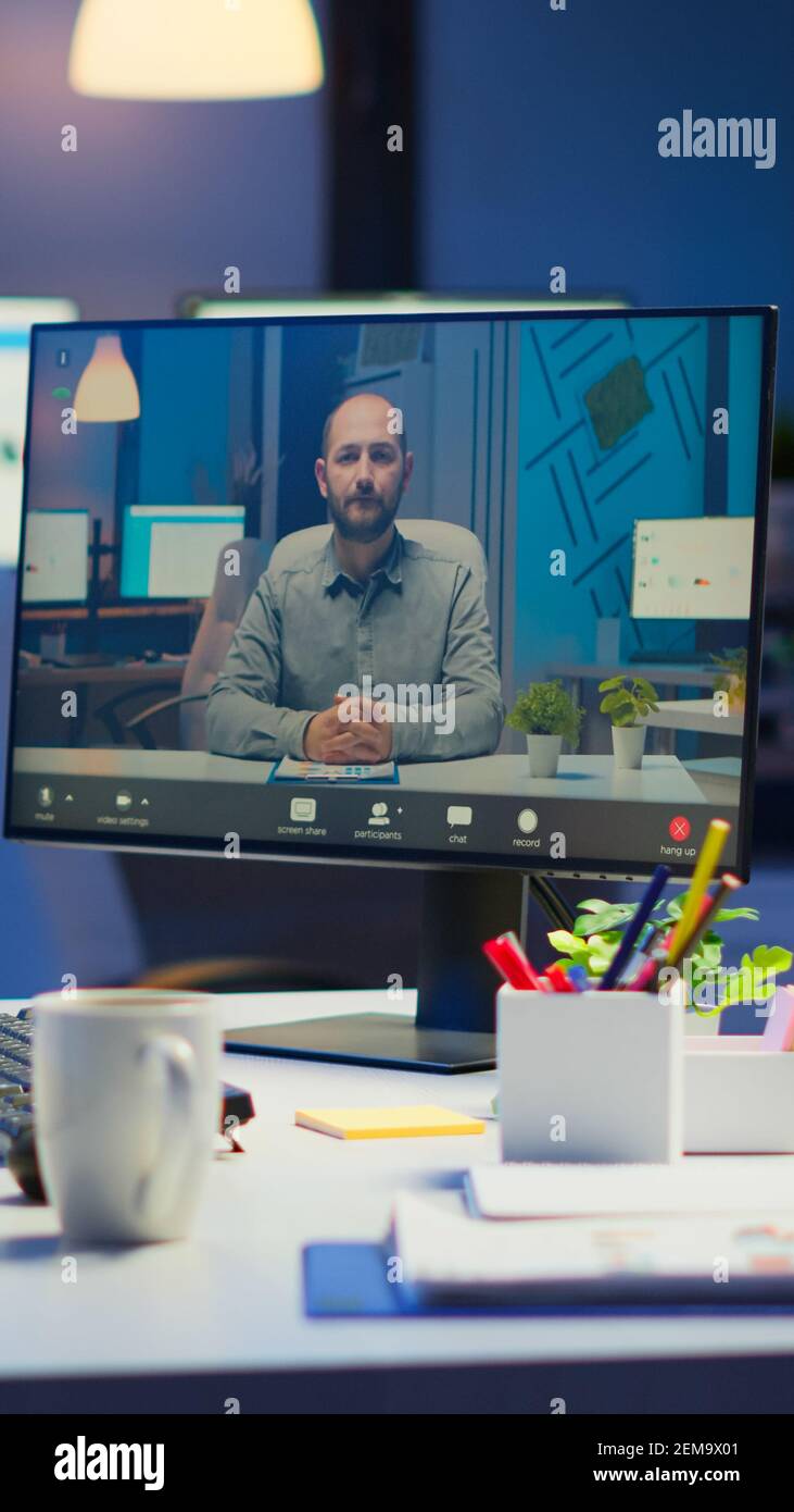 Woman freelancer discussing with client on video call at midnight from ...