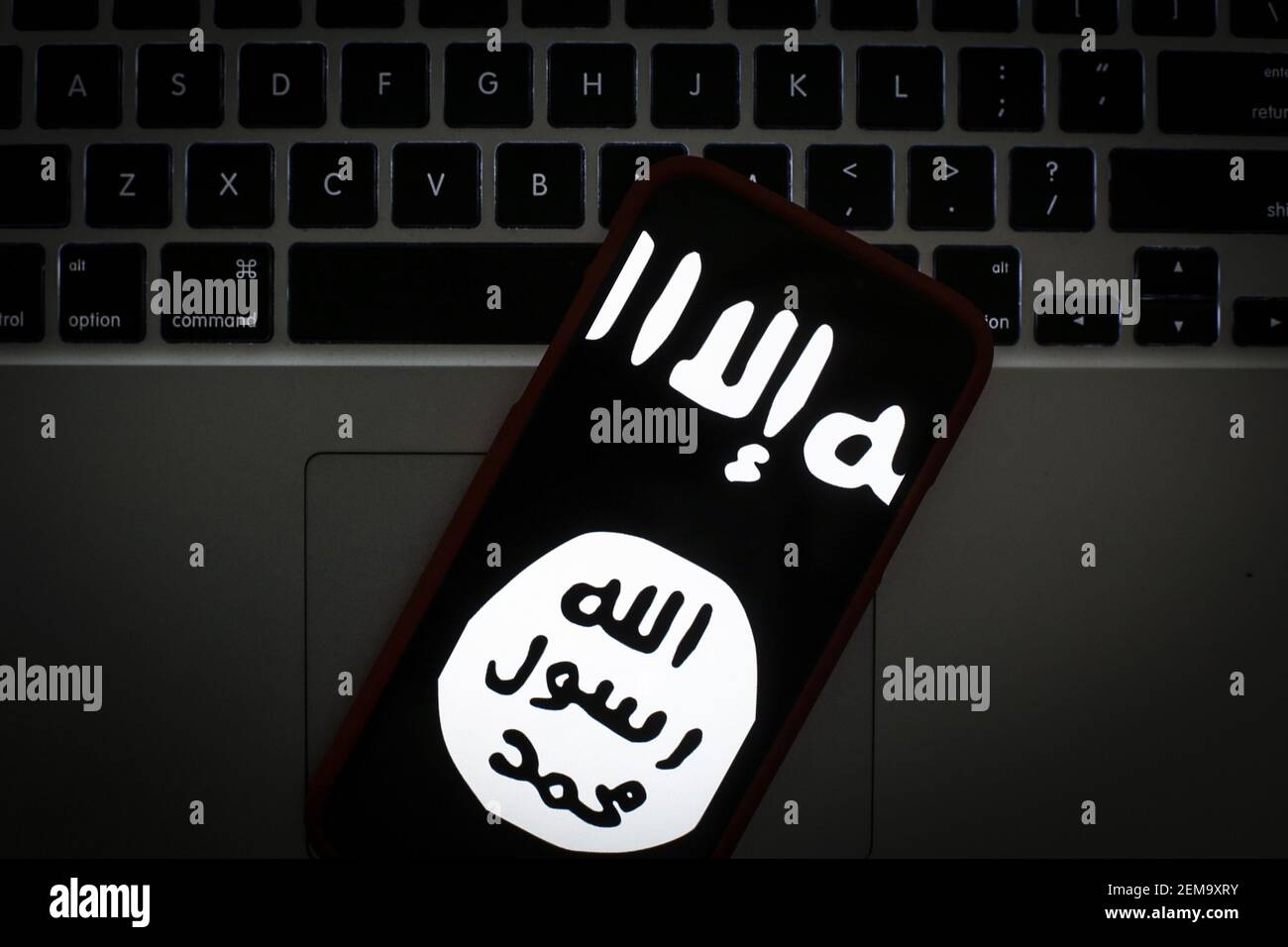 The Islamic State logo is seen on a portable mobile device in this ...