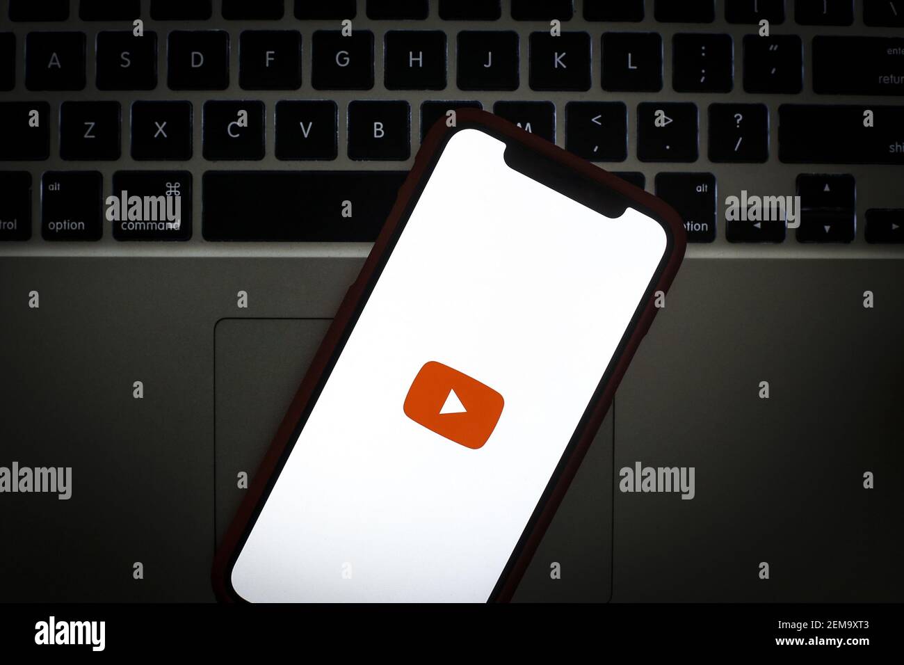 The YouTube logo is seen on a portable mobile device in this photo ...