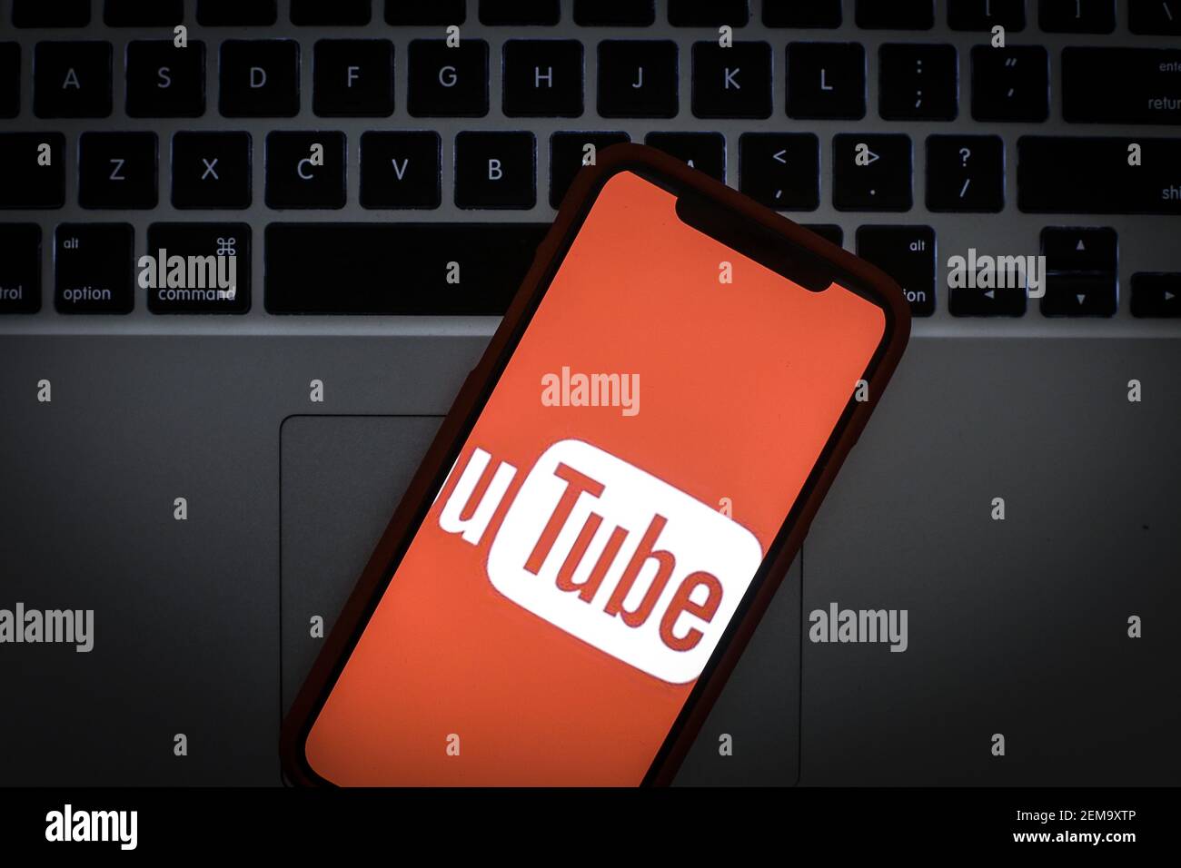The YouTube logo is seen on a portable mobile device in this photo ...