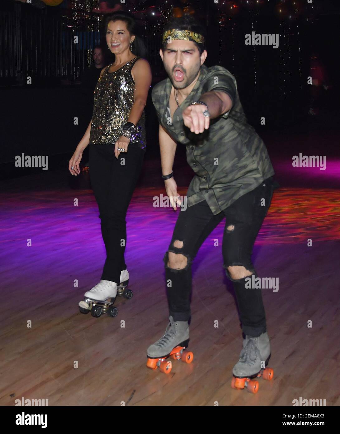 (L-R) Kelly Hu and Brayden Pierce roller skating at Jeannie Mai's 40th ...