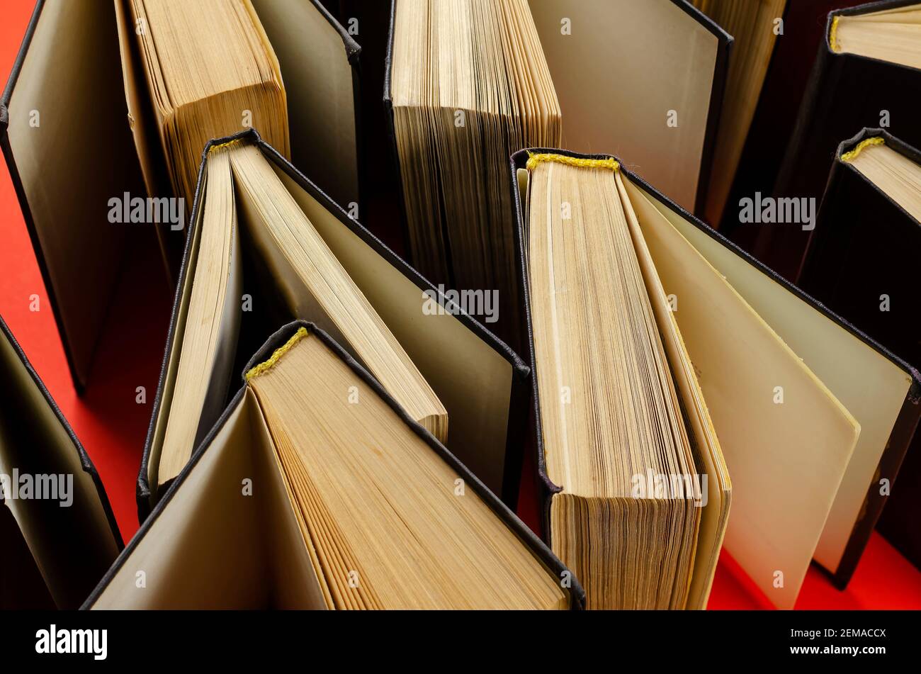 Composition with vintage old hardback books on red background. Books ...
