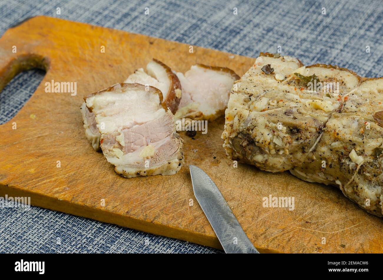 Traditional Ukrainian dish. Baked pork belly with spices on a wooden ...