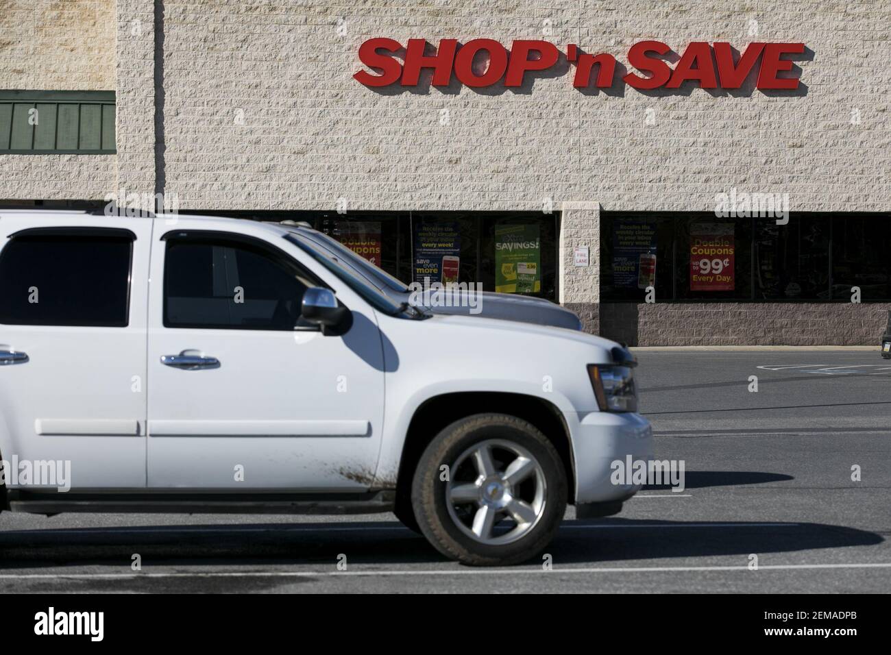 A logo sign outside of a SHOP 'n SAVE retail grocery store location in ...