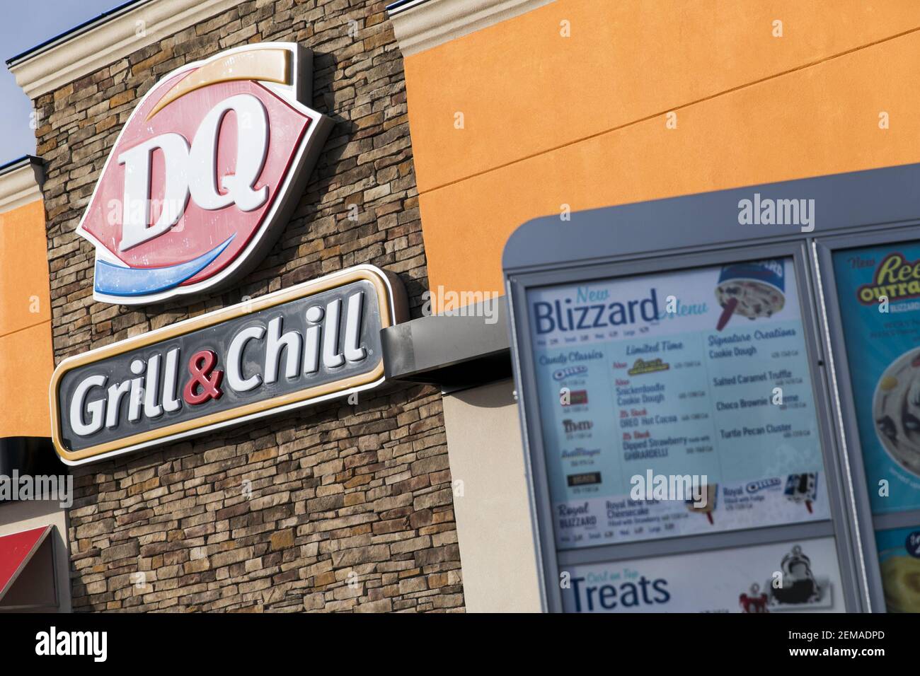 A logo sign outside of a Dairy Queen fast food restaurant location in ...