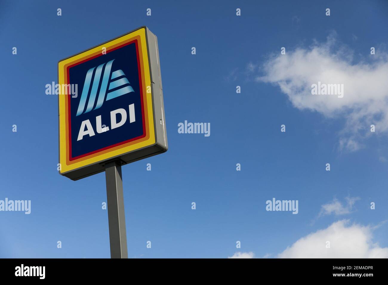 A logo sign outside of a Aldi retail grocery store location in ...