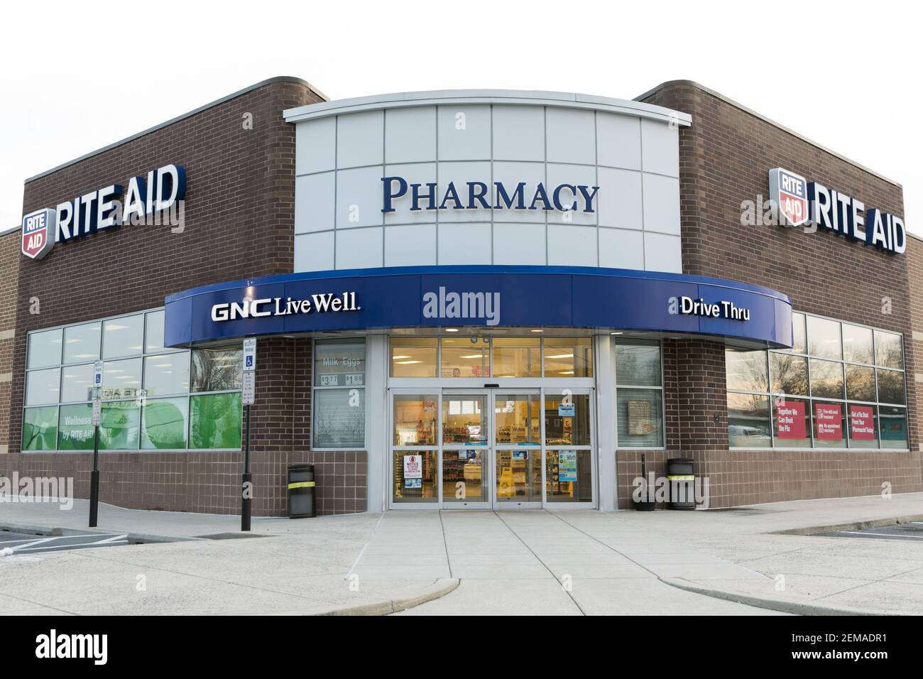A logo sign outside of a Rite Aid pharmacy and retail store location in ...