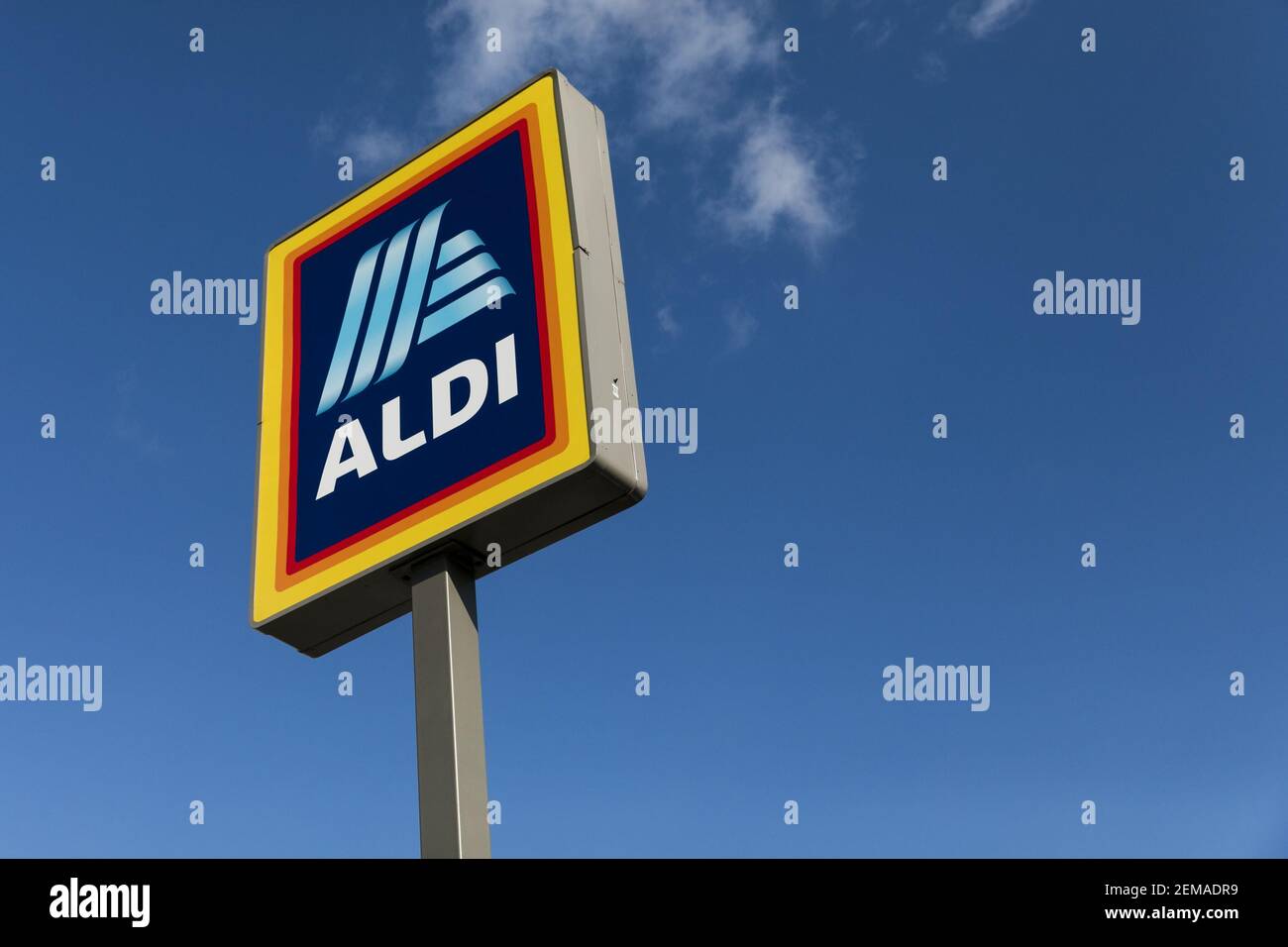 A logo sign outside of a Aldi retail grocery store location in ...